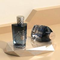China 100ml Glass Perfume Bottles Empty Unique Spray Triangle Spider Web Metal Cap for sale