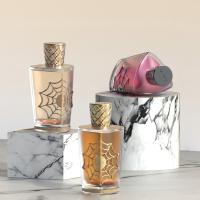 China 100ml Glass Perfume Bottles Empty Unique Spray Triangle Spider Web Metal Cap for sale
