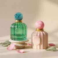 China Empty Perfume Bottles 100ml Ribbed Glass Cylinder Spray Ball Round Cap for sale