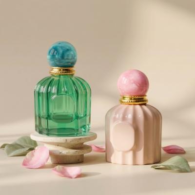 China Empty Perfume Bottles 100ml Ribbed Glass Cylinder Spray Ball Round Cap for sale