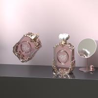 China Unique Perfume Bottles 100ml Glass Pink Metal Frame Pumpkin Cap Empty Spray Luxury for sale