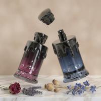 China 100ml Perfume Bottle Glass Unique Candle Shape Drip Cap Empty Spray Crimp Neck for sale