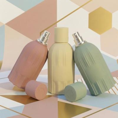 China 100ml Glass Perfume Bottles Cylinder Crimp Neck Magnetic Cap Empty Spray for sale