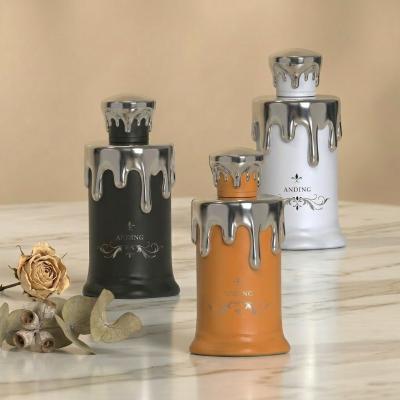 China 100ml Perfume Bottle Glass Unique Candle Shape Drip Cap Empty Spray Crimp Neck for sale