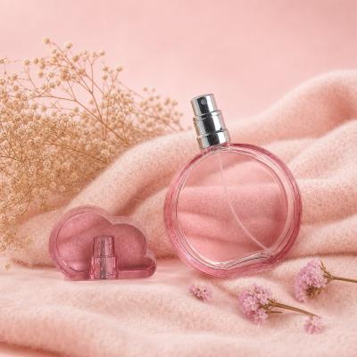 China 50ml 100ml Glass Perfume Bottles Round Empty Spray Cloud Shaped Cap Crimp Neck for sale