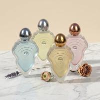 China 100ml Glass Perfume Bottle Empty Unique Irregular Shape Round Cap Crimp Neck for sale