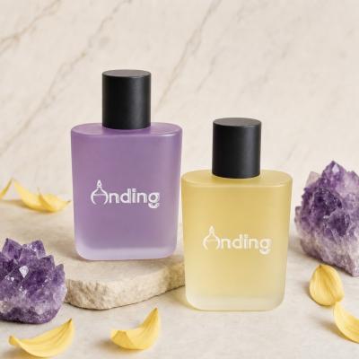 China 100ml Glass Perfume Bottles Cylinder Cap Spray Square Empty Crimp Neck for sale