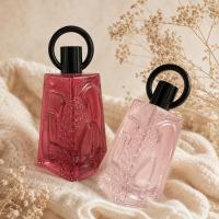 China 100ml Glass Perfume Bottles Textured Triangle Empty Ring Cap Crimp Neck Spray for sale