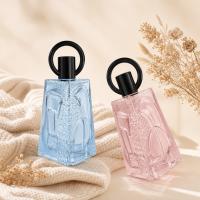 China 100ml Glass Perfume Bottles Textured Triangle Empty Ring Cap Crimp Neck Spray for sale