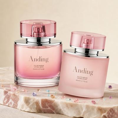China 80ml Glass Perfume Bottles Empty Flat Cylinder Crimp Neck Round Cap Spray for sale
