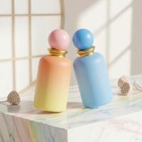 China Empty Glass Perfume Bottles 100ml Cylinder Crimp Neck Round Cap Spray for sale