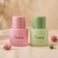 China Glass Perfume Bottles 50ml Cylinder Empty Plastic Cap Printing Luxury Design for sale