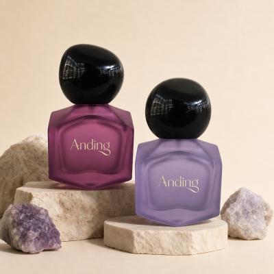 China 50ml Glass Perfume Bottles Square Crimp Neck Wholesale Custom Black Plastic Cap for sale