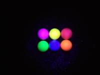 China Fluorescent Golf Balls Glow in UV Black Light 2.5 Inch Night Play for sale