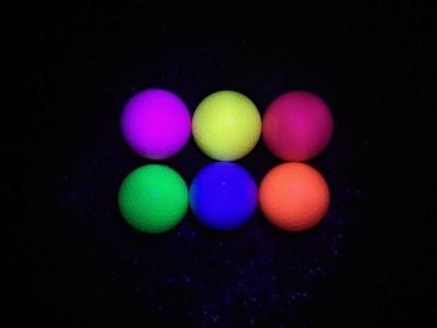 China Fluorescent Golf Balls Glow in UV Black Light 2.5 Inch Night Play for sale