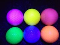 China Fluorescent Golf Balls Glow in UV Black Light 2.5 Inch Night Play for sale