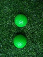 China Fluorescent Golf Balls Glow in UV Black Light 2.5 Inch Night Play for sale