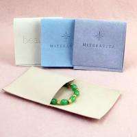 China custom embossed suede microfiber jewelry pouch with insert card pads custom logo for sale