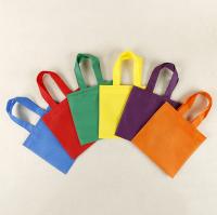 China Reusable Non-Woven Favor Bags 9.5x9.5 Inch Pinata Goodie Gift Bag Colorful Tote Candy Bags for Birthday Party for sale