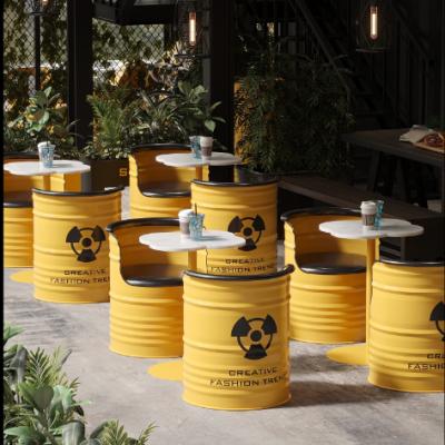 China Industrial Oil Drum Table and Chair Set Iron Frame PU Leather 12 Colors Outdoor Cafe Furniture for sale