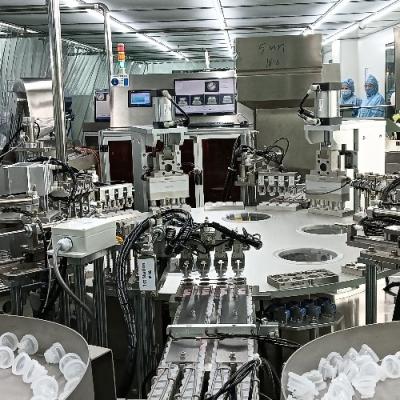 China Turntable Type Infusion Bottle Double-Fold Cap Assembly Machine for sale