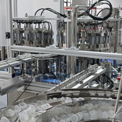 China High Precision Servo Motor Double Folding Cover Assembly Machine with 14000-18000pcs/h Capacity and Stainless Steel + Aluminum Alloy Construction for sale