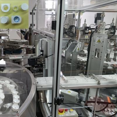 China Customizable Milk Paper Bottle Cap Assembly Machine For Automatic Heli Cover Capping Machine for sale