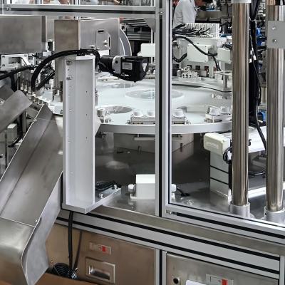 China Automated Infusion Film Cap Assembly Machine Made Of Stainless Steel Not Easy To Rust for sale