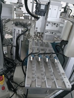 China Heli cap, milk cap and juice cap assembly machine for sale