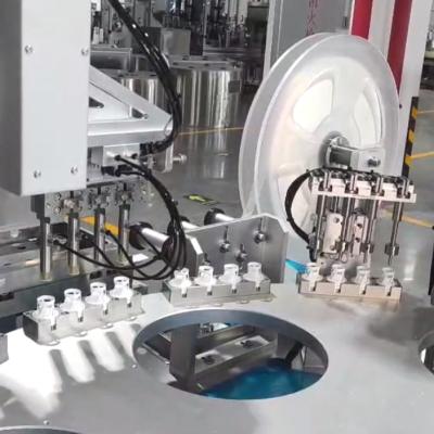 China 220V Silica Gel Desiccant Cap Assembly Machine with PLC Control for sale