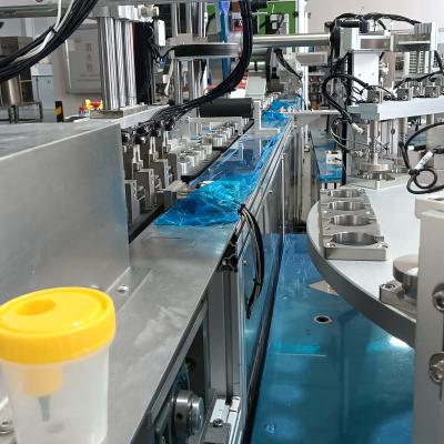 China Non-standard automated urine cup assembly machine, labelling and packaging integrated machine, high efficiency for sale