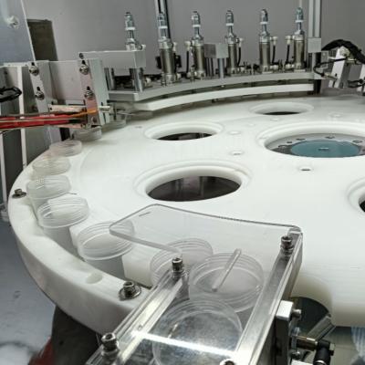 China Automatic Urine Cup Assembly Machine with 99% Qualified Rate 2500-10000pcs/hr Easy to Use Operation for sale