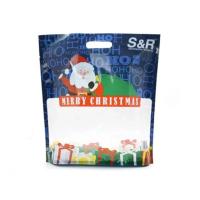China Customized Printed Stand Up Pouch Zipper Christmas Gift Wrap Bags With Handle Hole for sale
