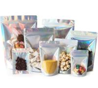 China 0.5OZ Holographic Stand Up Pouch Silver ziplockk Foil Bag Pouches With Tear Notch for sale