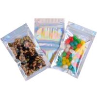 China 0.5OZ Holographic Stand Up Pouch Silver ziplockk Foil Bag Pouches With Tear Notch for sale