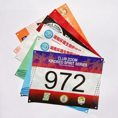 China Digital Plate Sport Race Bib Number Cloth Customized Athletic Number Book for Marathon Running Events for sale