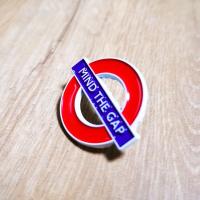 China Round Zinc Alloy Die Cast Custom Enamel Pin 30x25mm White Painting Promotional Gift for sale