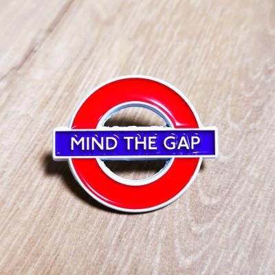China Round Zinc Alloy Die Cast Custom Enamel Pin 30x25mm White Painting Promotional Gift for sale