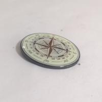 China Custom Iron Stamped Round Lapel Pins 1.25 Inch Compass Design Black Nickel Epoxy Coated for sale