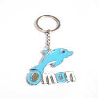 China 2 Inch Omani Dolphin Iron Stamped Keychain Soft Enamel 2mm Thickness for sale