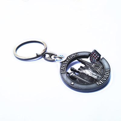 China Antique Silver Zinc Alloy Key Chain 40mm Souvenir with Rotated Design and Keyring for sale