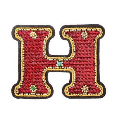 China Custom Size Luxury Red Sequin Bead Diamond Embroidered Letter Patch Exquisite PU Rubber Letter Patch H for sale