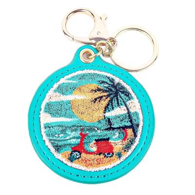 China Customized Leather Round High-Quality Keychain Backpack Pendant Embroidery Business Gifts for sale