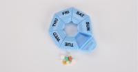China One week 7 compartments round shaped plastic pill organizer, Travel plastic pill containers 7 compartment space planner for sale