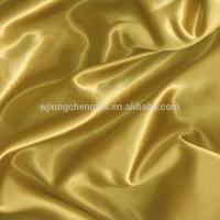 China Flame Retardant 100% Polyester Woven Gold Satin Fabric For Apparel for sale