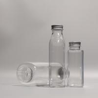 China Transparent Food Grade PET Plastic Bottles 250ml to 2L with Aluminum Cap BPA Free for sale