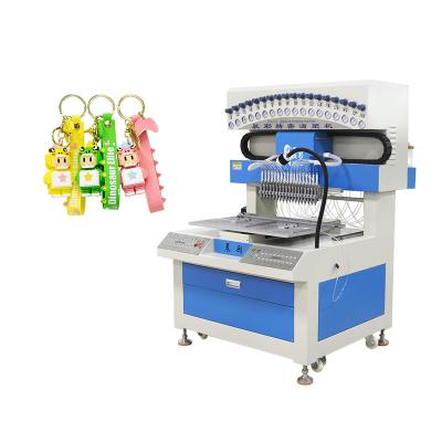 China Automatic PVC Silicone Dispensing Machine 325kg with 18 Color Capability for Keychain Production for sale