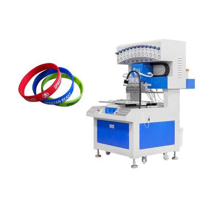 China Automatic Silicone Bracelet Making Machine 12 Color PVC Shoe Outsole Dripping Machine for sale