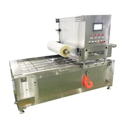 China Automatic Egg Tray Packing Machine 380V 5.5kW Food Tray Sealer 2000-2800 Trays Per Hour for sale