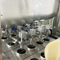 China Automatic Yogurt Cup Filling Sealing Machine 4000-12000 Cups Per Hour SUS304 for sale